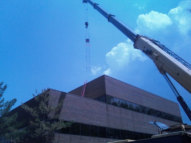 Installation of a Parapet Crossover Fixed Ladder - A-Mezz Blog